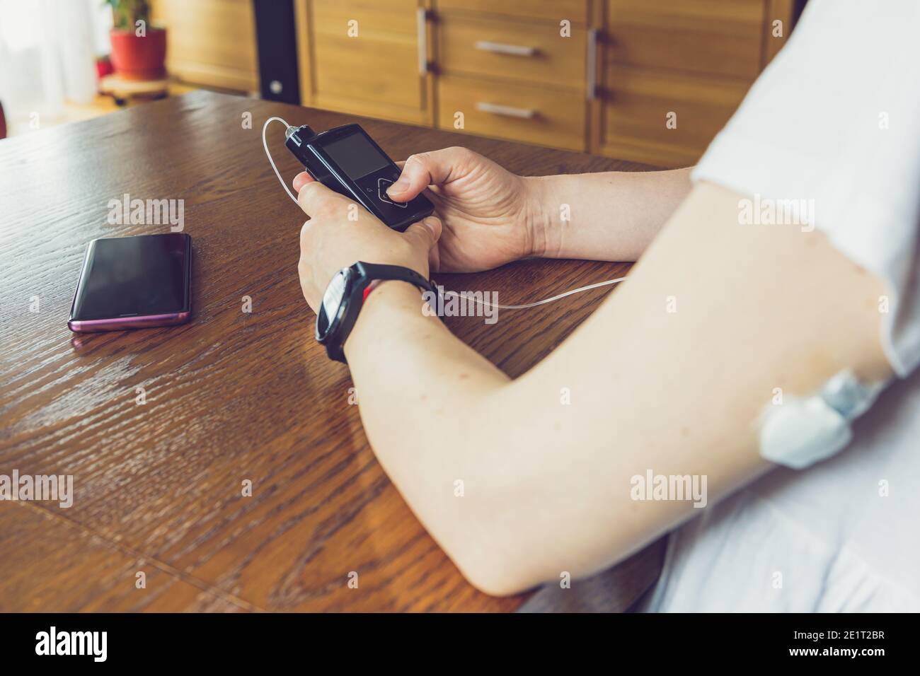 Modern diabetes treatment, woman checking glucose level and dosing ...