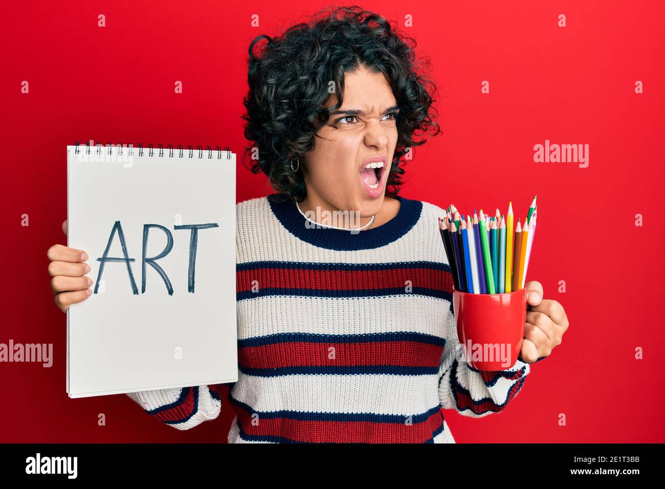Portrait of woman holding pencil drawing book hi-res stock photography ...