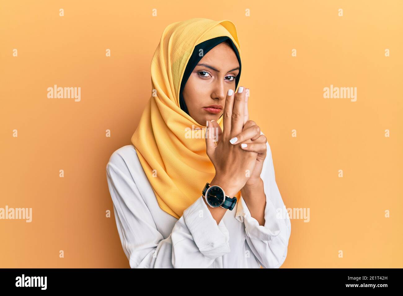 Young brunette arab woman wearing traditional islamic hijab scarf ...
