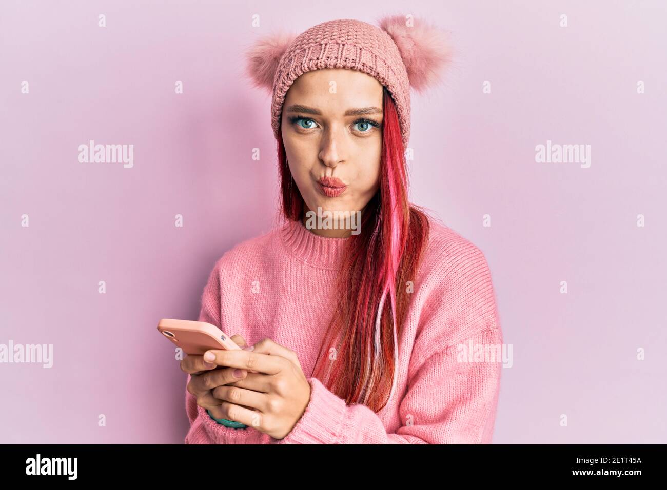 Young caucasian woman having conversation talking on the smartphone ...