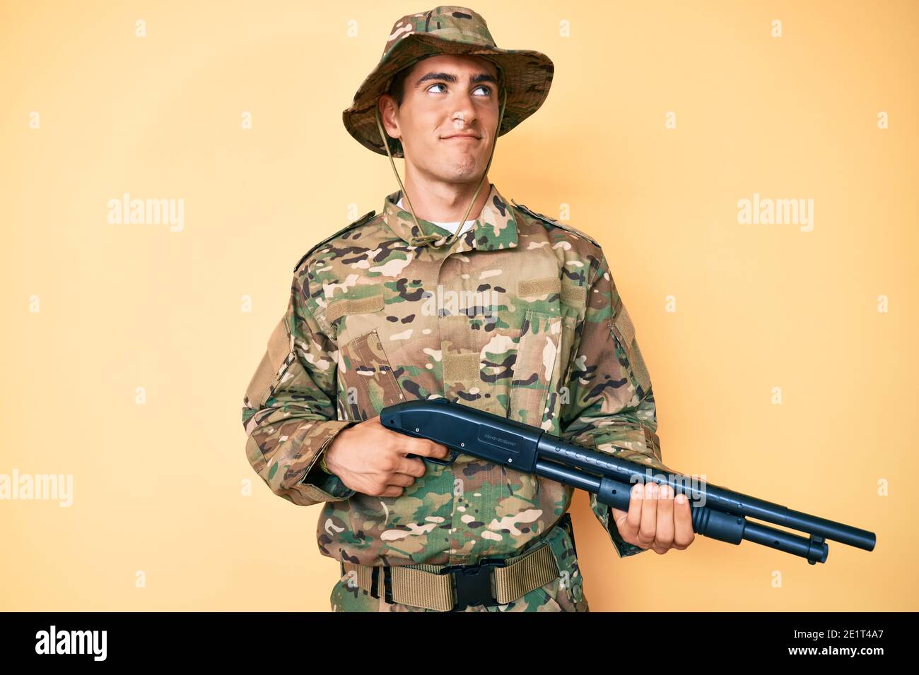 Weapon holding looking away military army soldier uniform hi-res stock ...