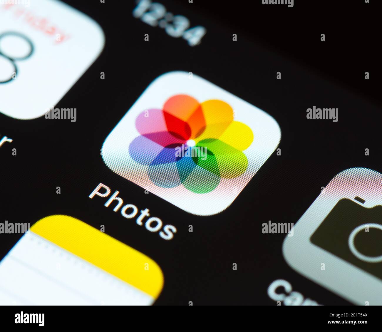 Photos app icon on Apple iPhone screen Stock Photo - Alamy