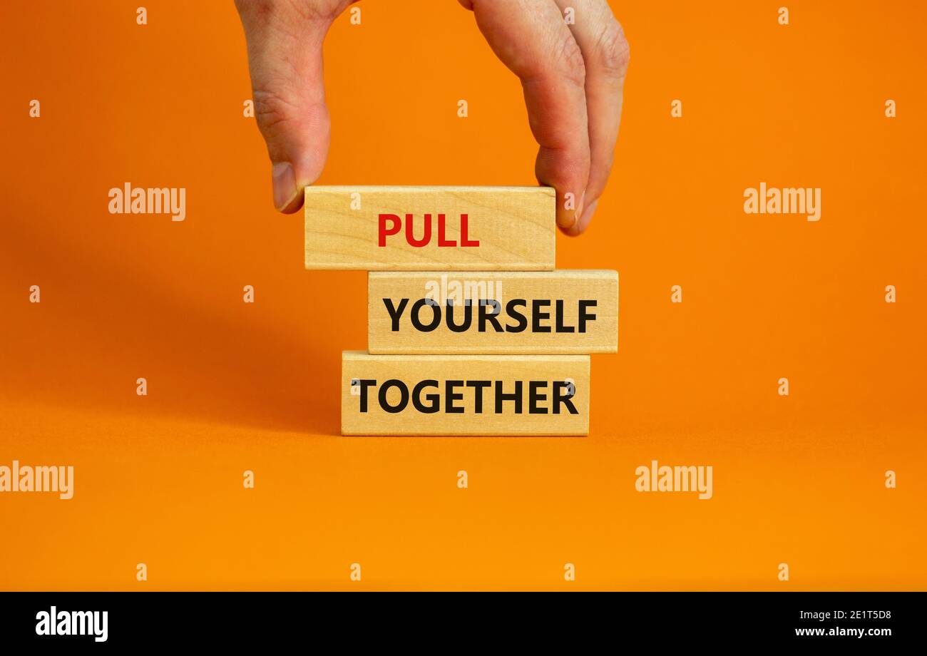 Pull yourself together symbol. Wooden blocks with words 'Pull yourself ...