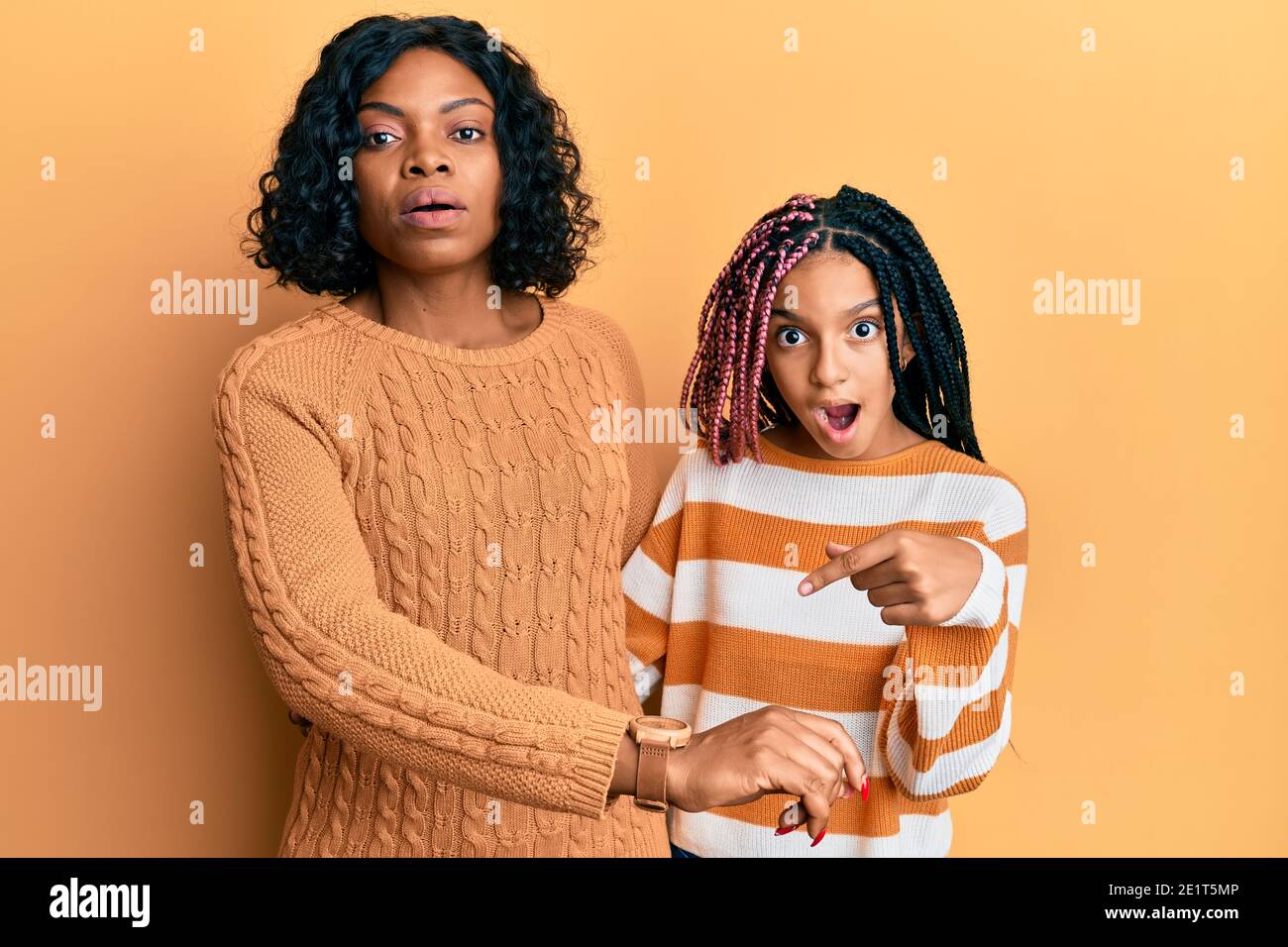 Beautiful african american mother and daughter wearing wool winter ...
