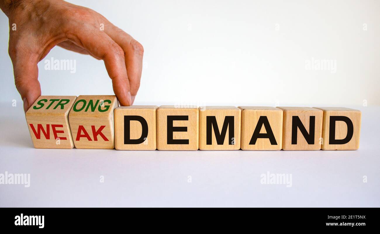 Strong Or Weak Demand Symbol Businessman Hand Turns Cubes And Changes strong-or-weak-demand-symbol-businessman-hand-turns-cubes-and-changes