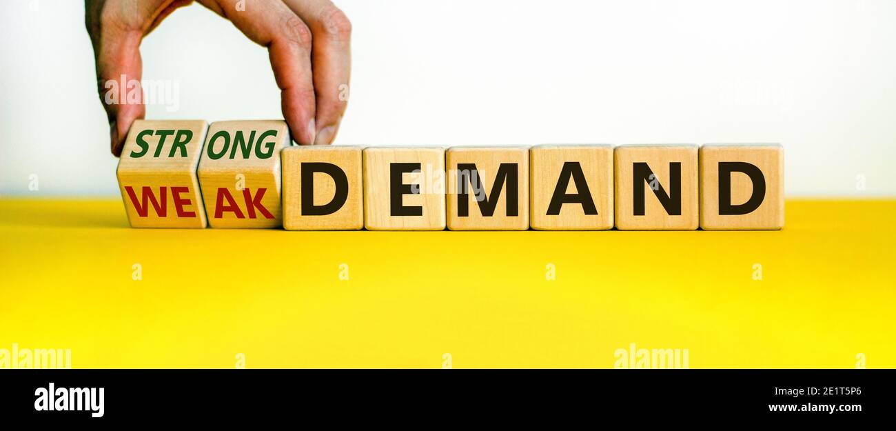 Strong or weak demand symbol. Businessman hand turns cubes and changes ...