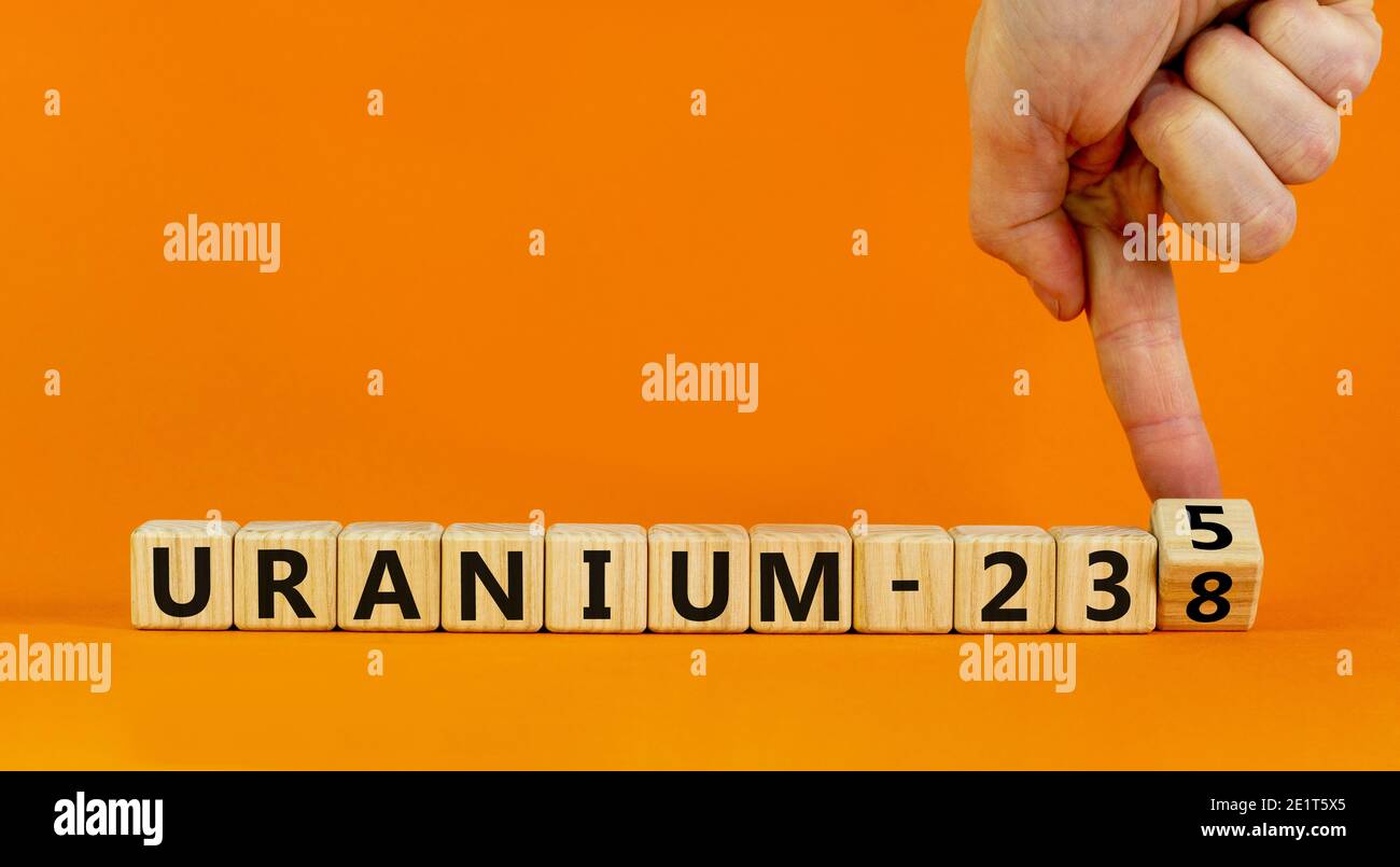 Uranium enrichment symbol. Hand turns cube and changes words 'uranium ...