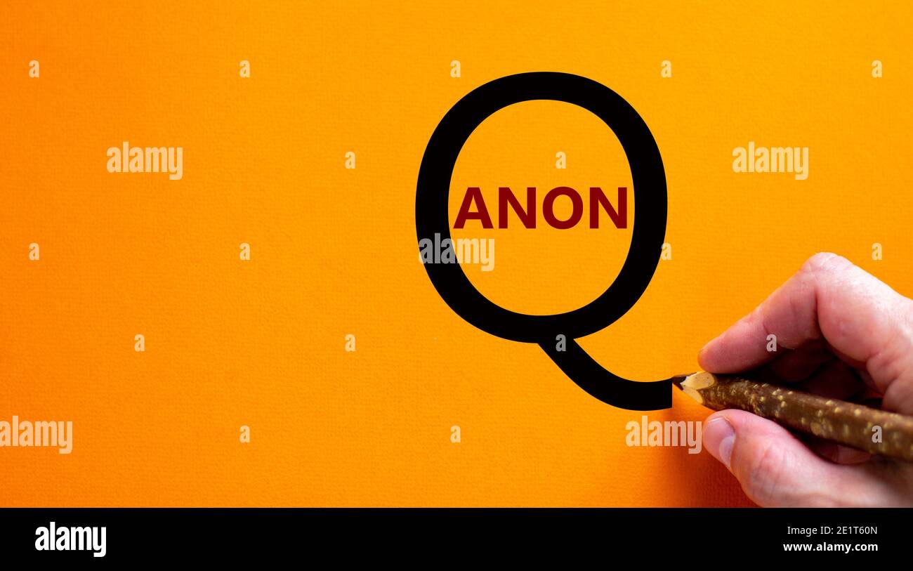 Q Anon symbol. Hand writing words 'Q Anon', isolated on beautiful ...