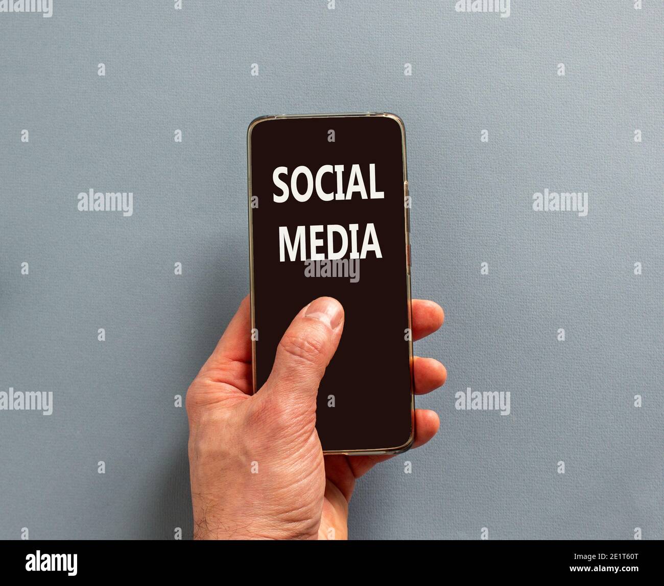 Social media symbol. Male finger clicks on smartphone screen with a ...