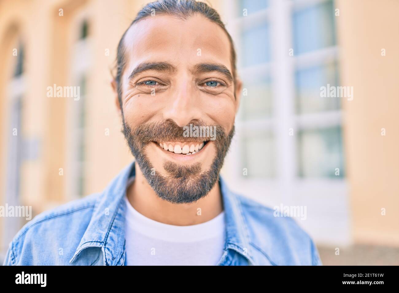 Young middle eastern man smiling happy walking at the city Stock Photo ...