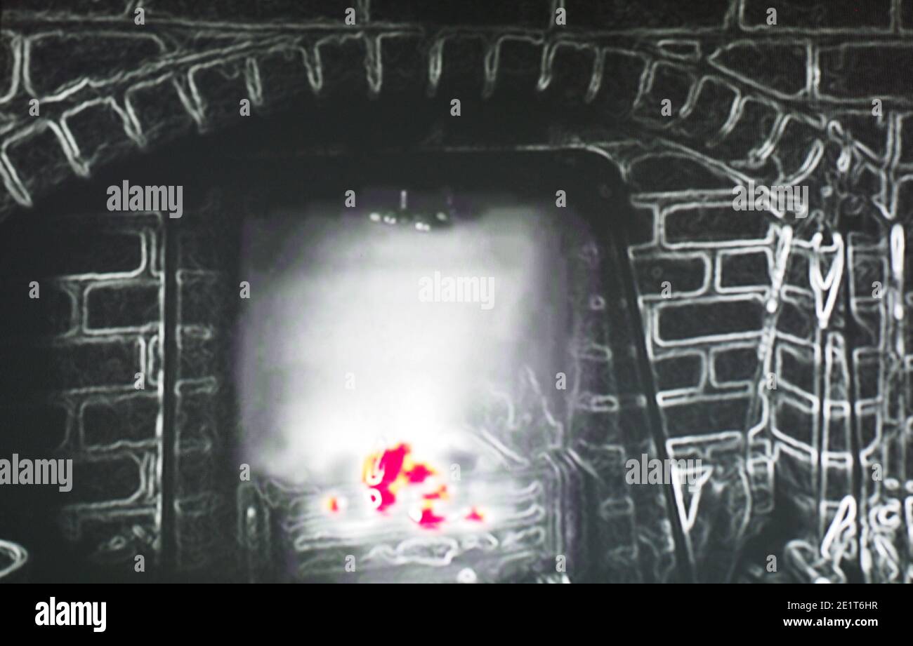 an infrared camera view of a coal fire burning in a domestic hearth ...