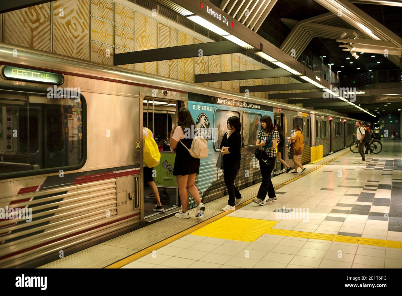 People getting on the train at Universal City. Metro in Los Angeles, CA ...