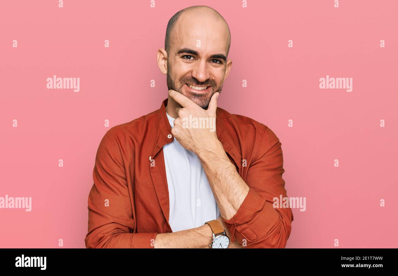 Young hispanic man wearing casual clothes looking confident at the ...