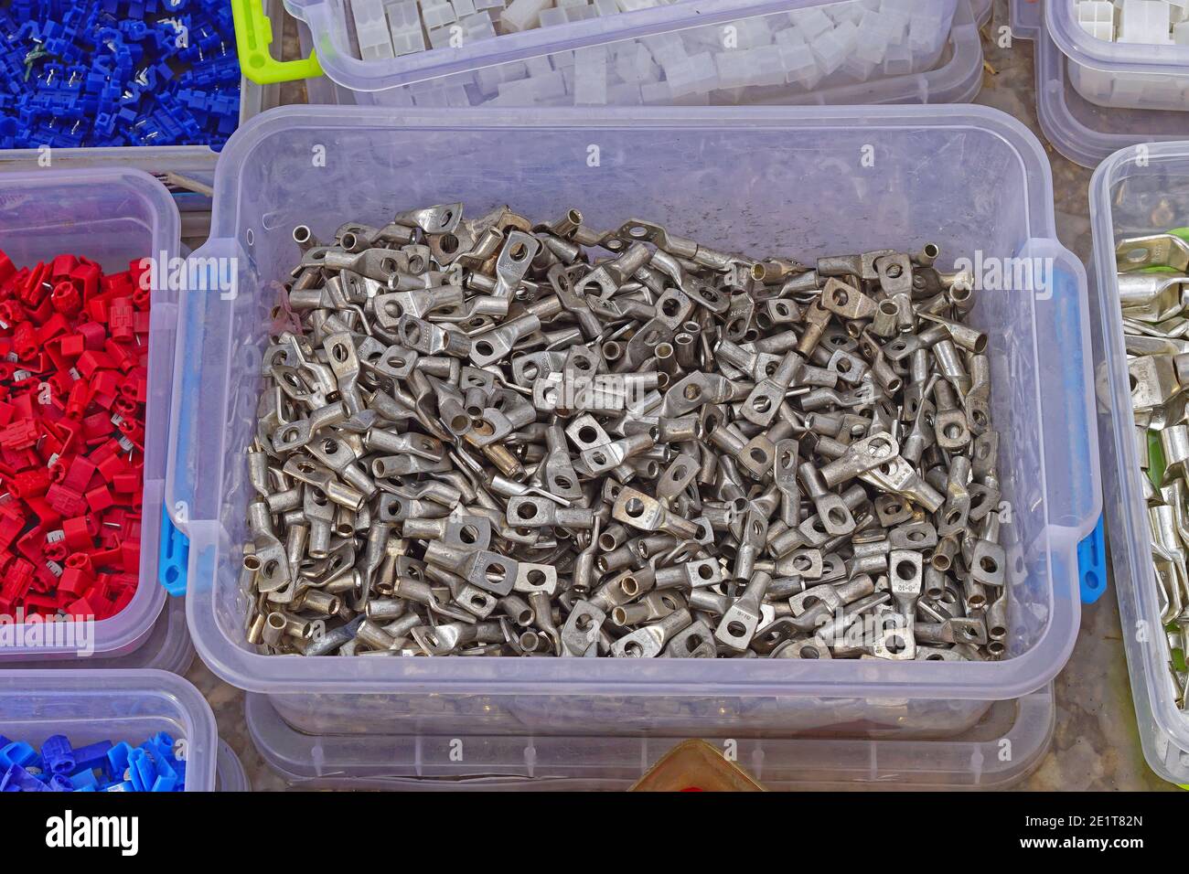 Many eye terminal connectors parts in box Stock Photo - Alamy