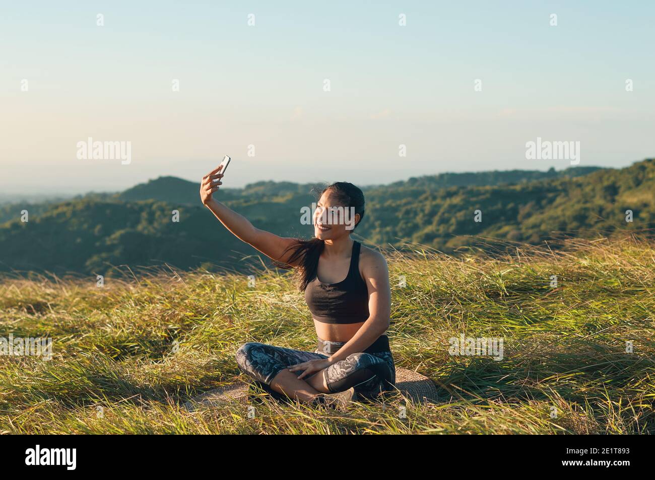 A Relaxed Young Woman Taking A Selfie On A Smartphone After Exercising