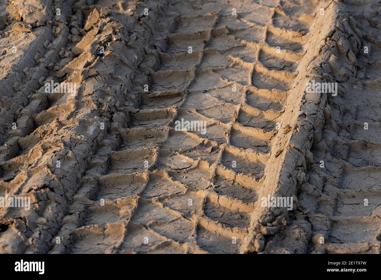 Big car wheel trace on road, puddle and mud. Ground Stock Photo - Alamy
