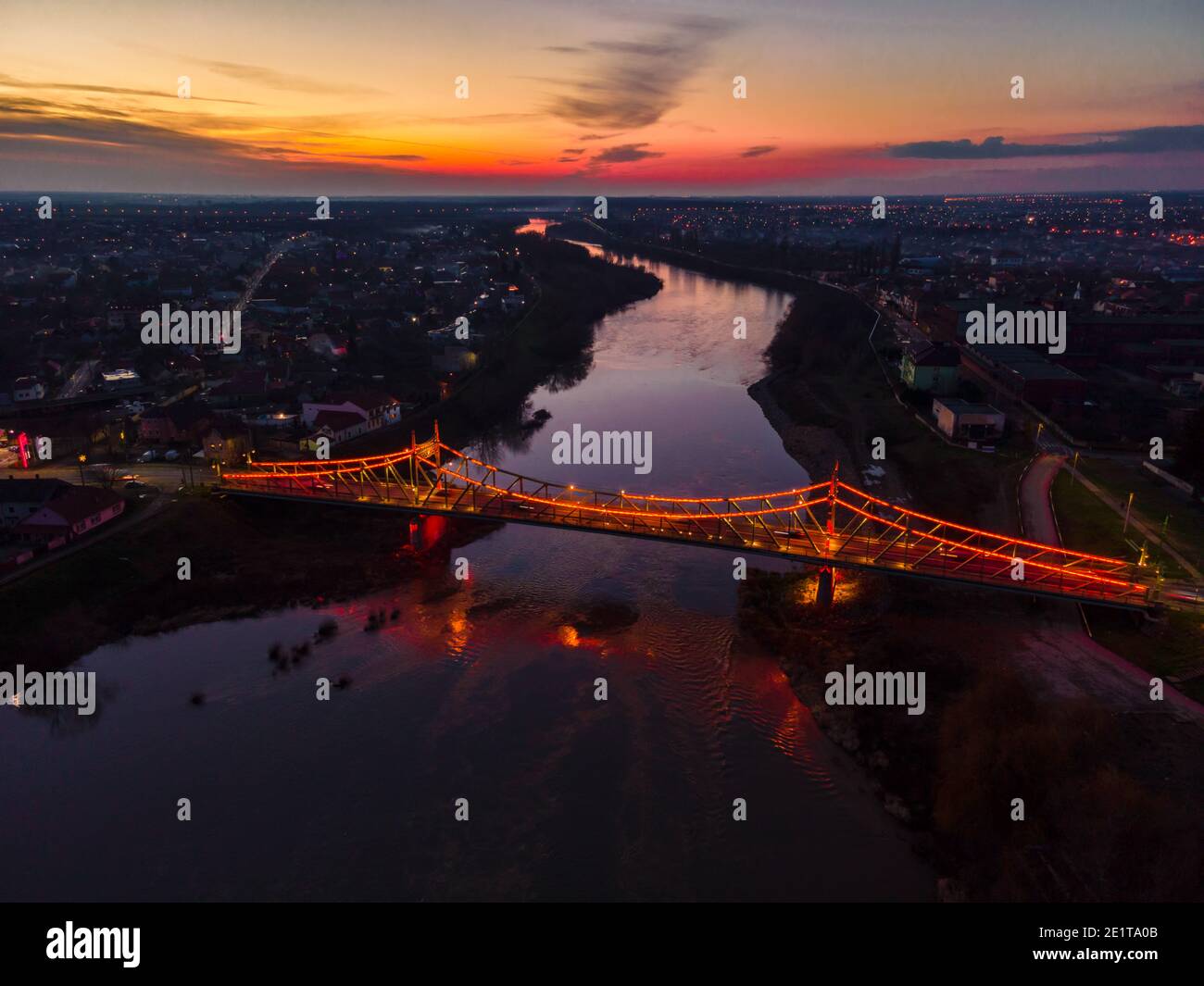 Aerial photography of a luminated bridge over water at sunset Stock ...