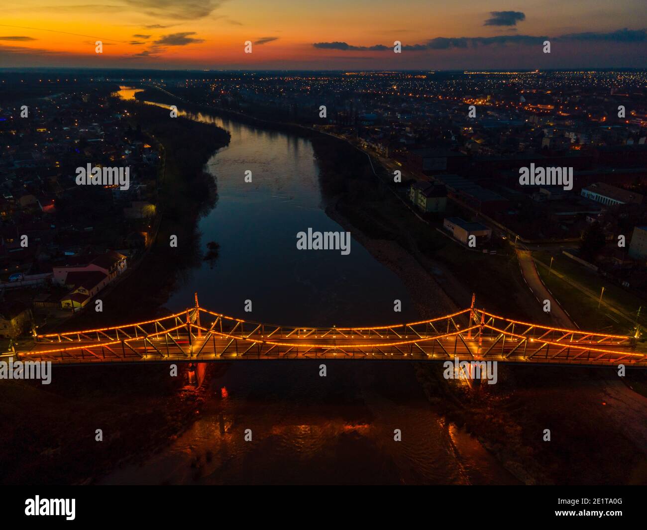 Aerial photography of a luminated bridge over water at sunset Stock ...