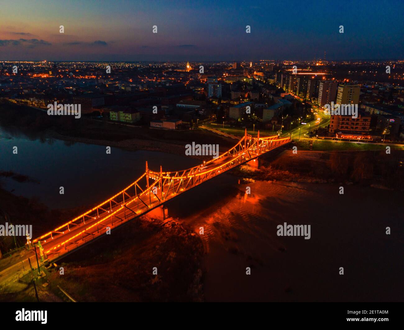 Aerial photography of a luminated bridge over water at sunset Stock ...