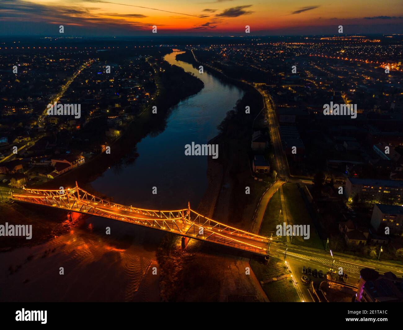 Aerial photography of a luminated bridge over water at sunset Stock ...