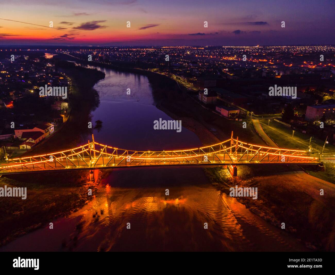 Aerial photography of a luminated bridge over water at sunset Stock ...