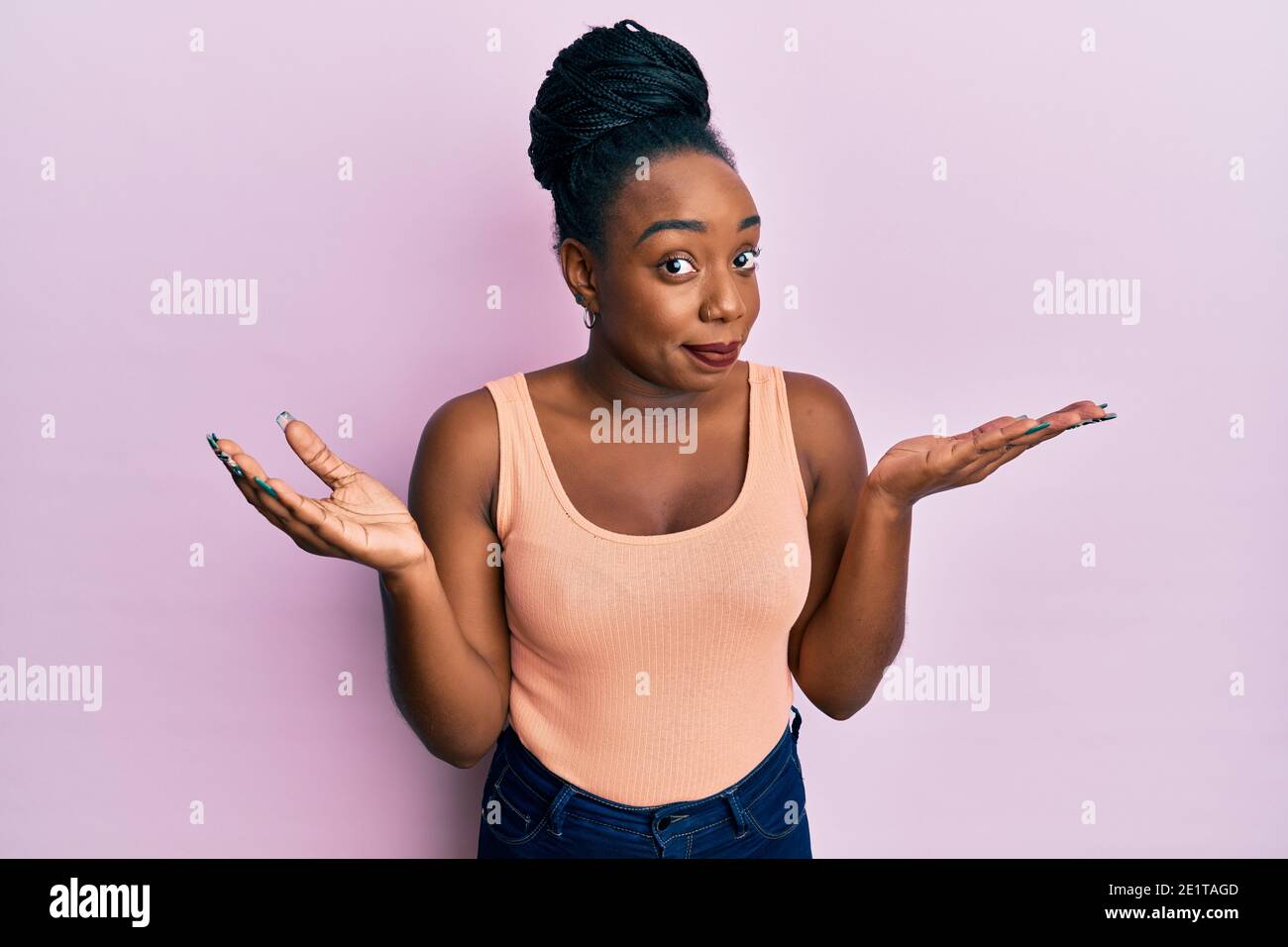 Young african american woman wearing casual style with sleeveless shirt ...