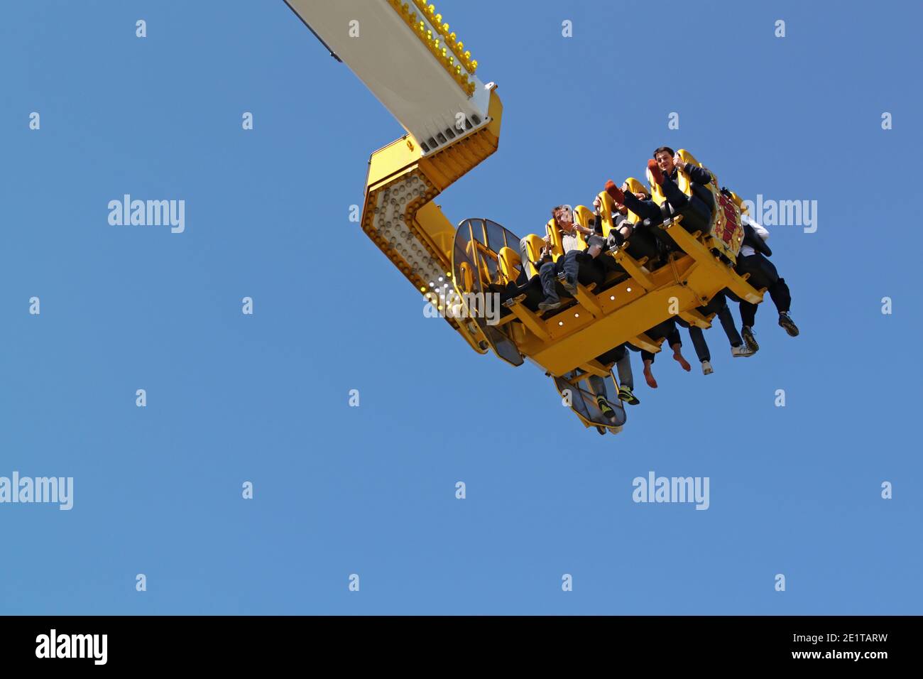 Amusement park rides with blue sky as background Stock Photo - Alamy