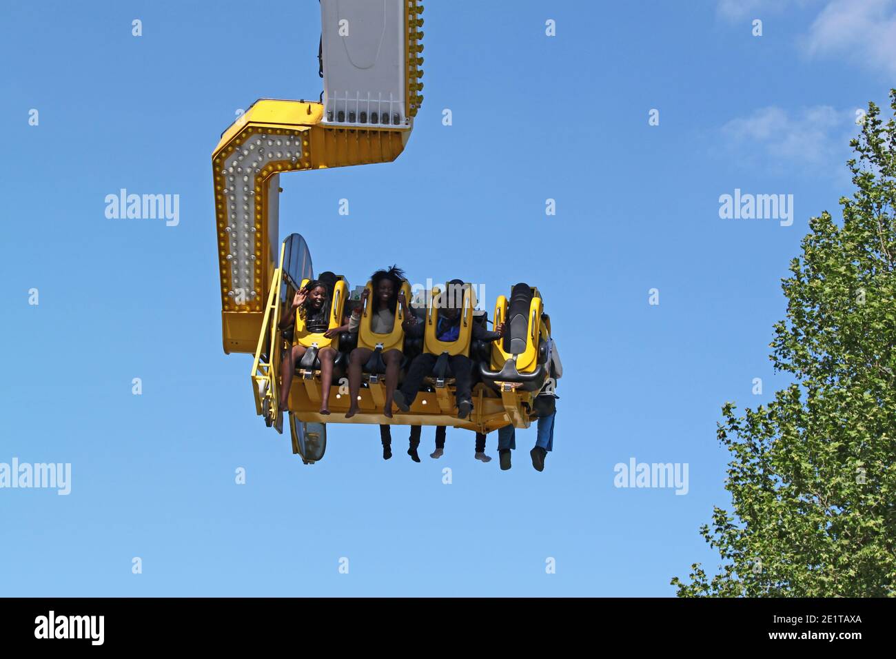 Amusement park rides with blue sky as background Stock Photo - Alamy