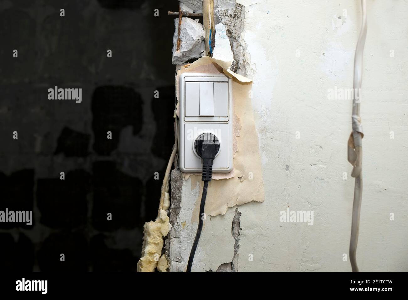 Electric cables and switch in cracked wall during a renovation Stock ...