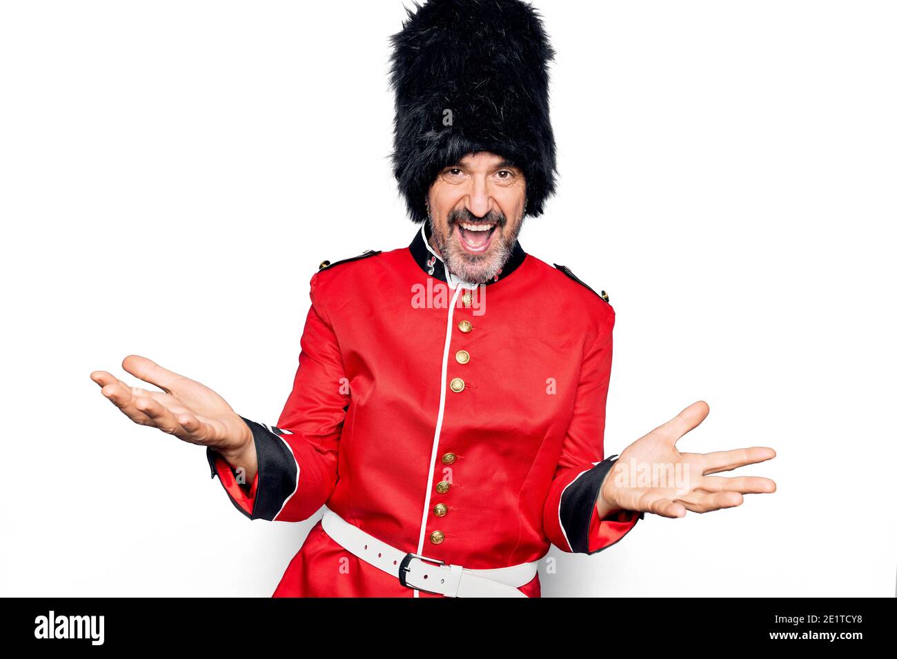 Middle age handsome wales guard man wearing traditional uniform over ...