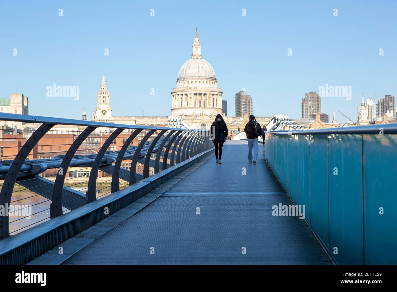 People crossing the millennium bridge on a sunny day Stock Photo - Alamy