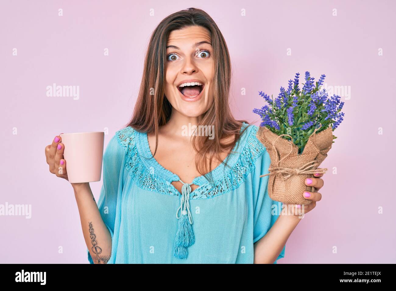 Beautiful caucasian woman drinking a cup of infused lavender ...