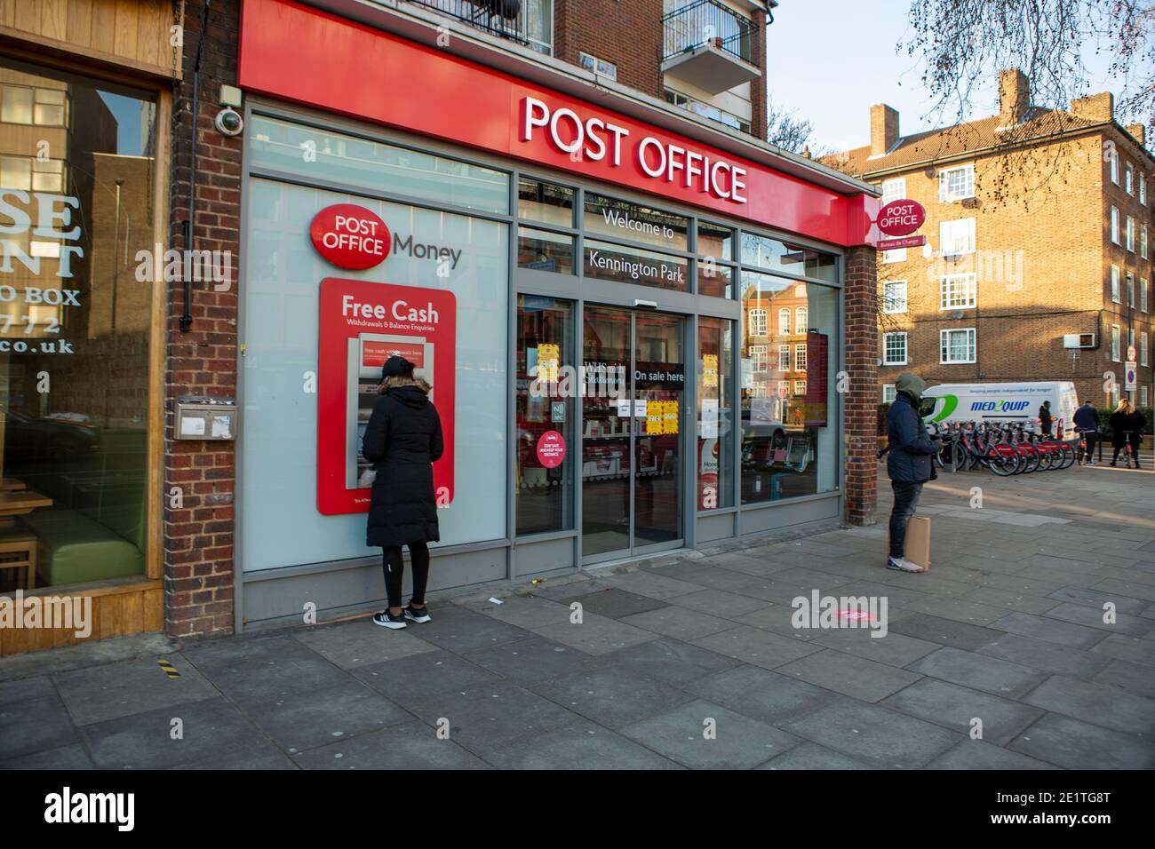 London, UK. 9th Jan, 2021. A woman seen withdrawing money from Post ...