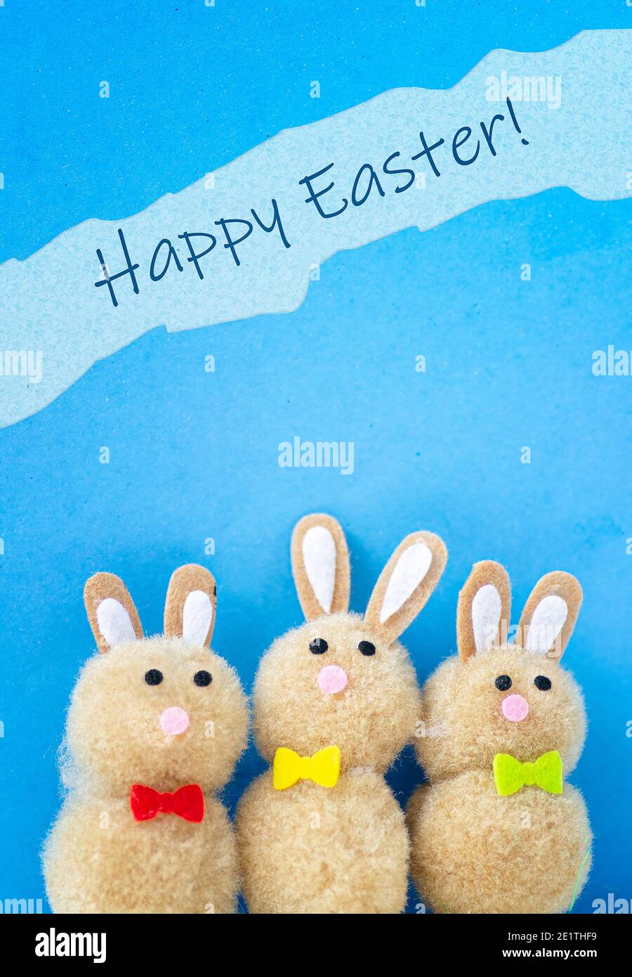 Easter bunnies with a tear above them revealing a Happy Easter message ...