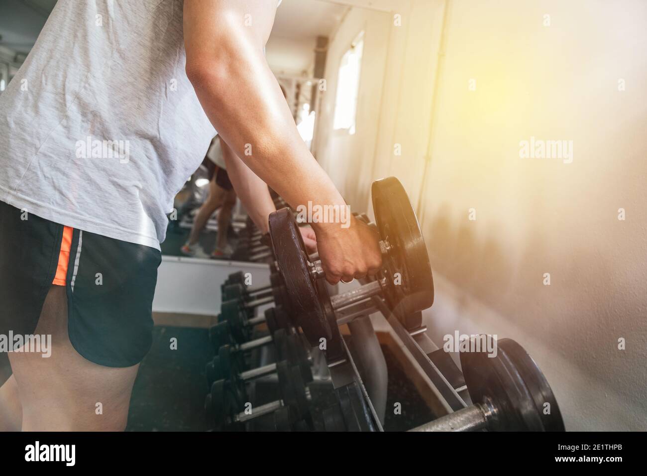 Hand holding weight in the gym. Close up. Focus is on hand Stock Photo ...
