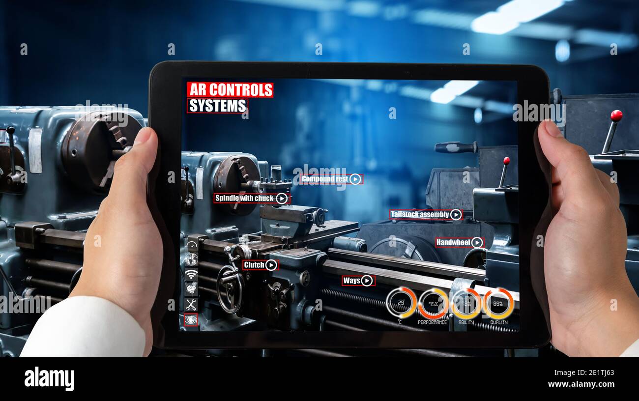 Engineer use augmented reality software in smart factory production line with automated ...