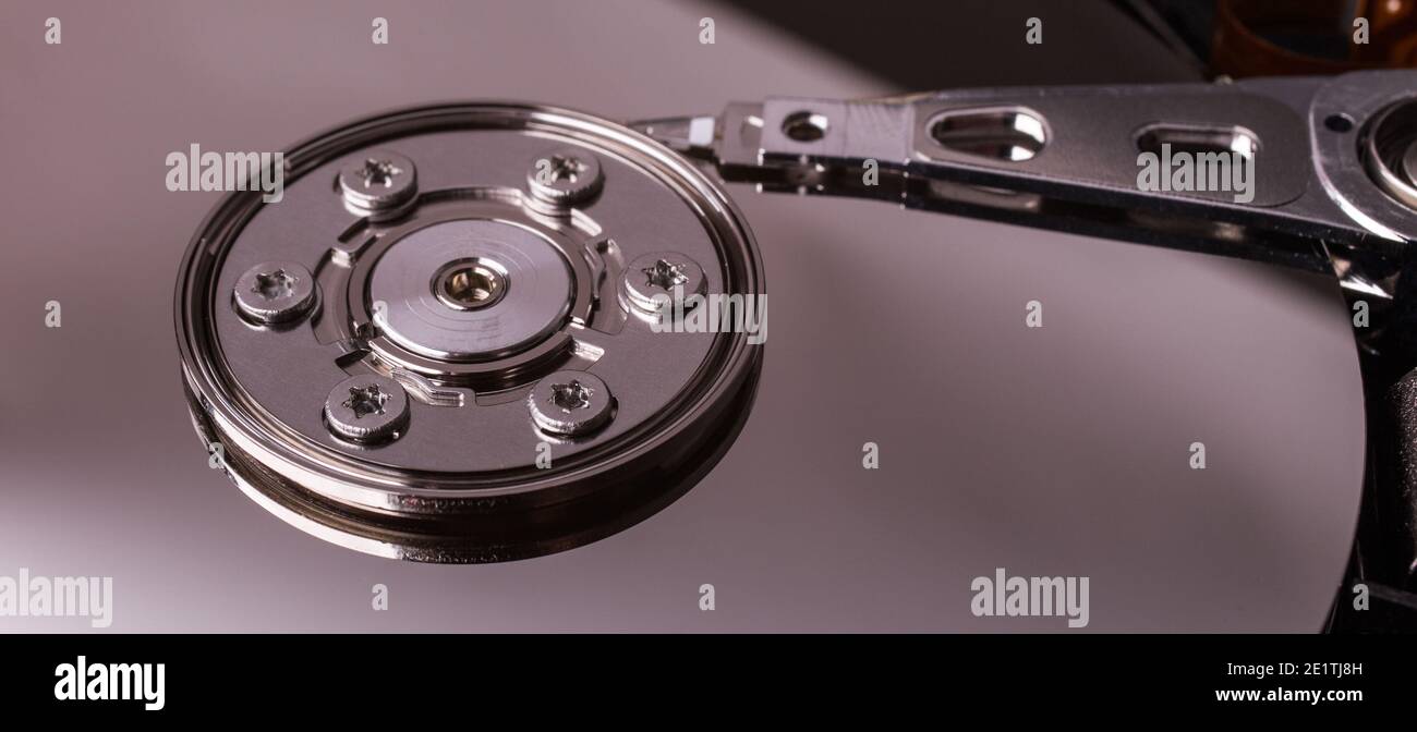 Macro view of spindle of the open hard disk drive, HDD, detail, banner ...