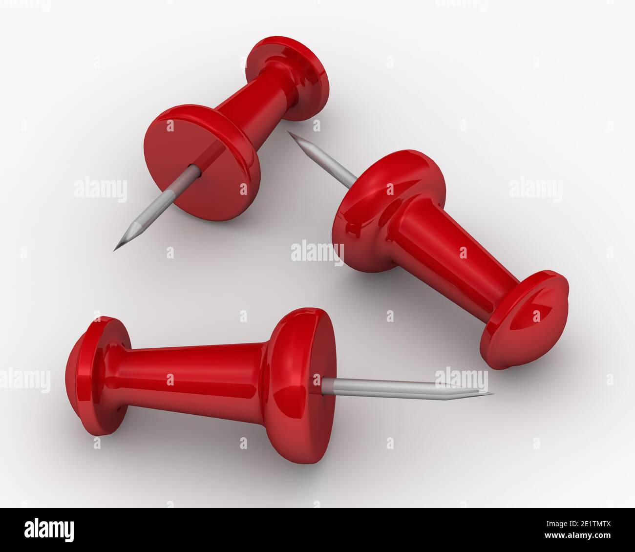 Pushpin. Red pushpin lie on a white surface. The three-dimensional ...