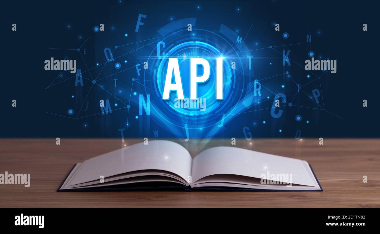 API inscription coming out from an open book, digital technology ...