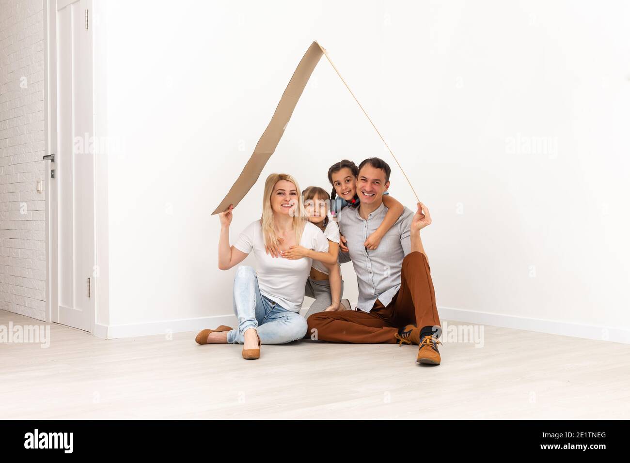 concept housing a young family. mother father and children in a new ...