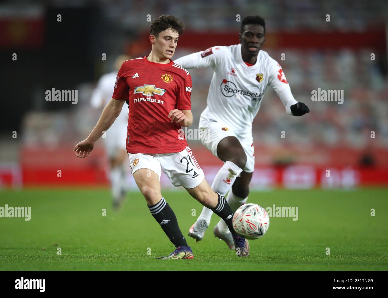 Manchester United's Daniel James (left) and Watford's Ismaila Sarr ...