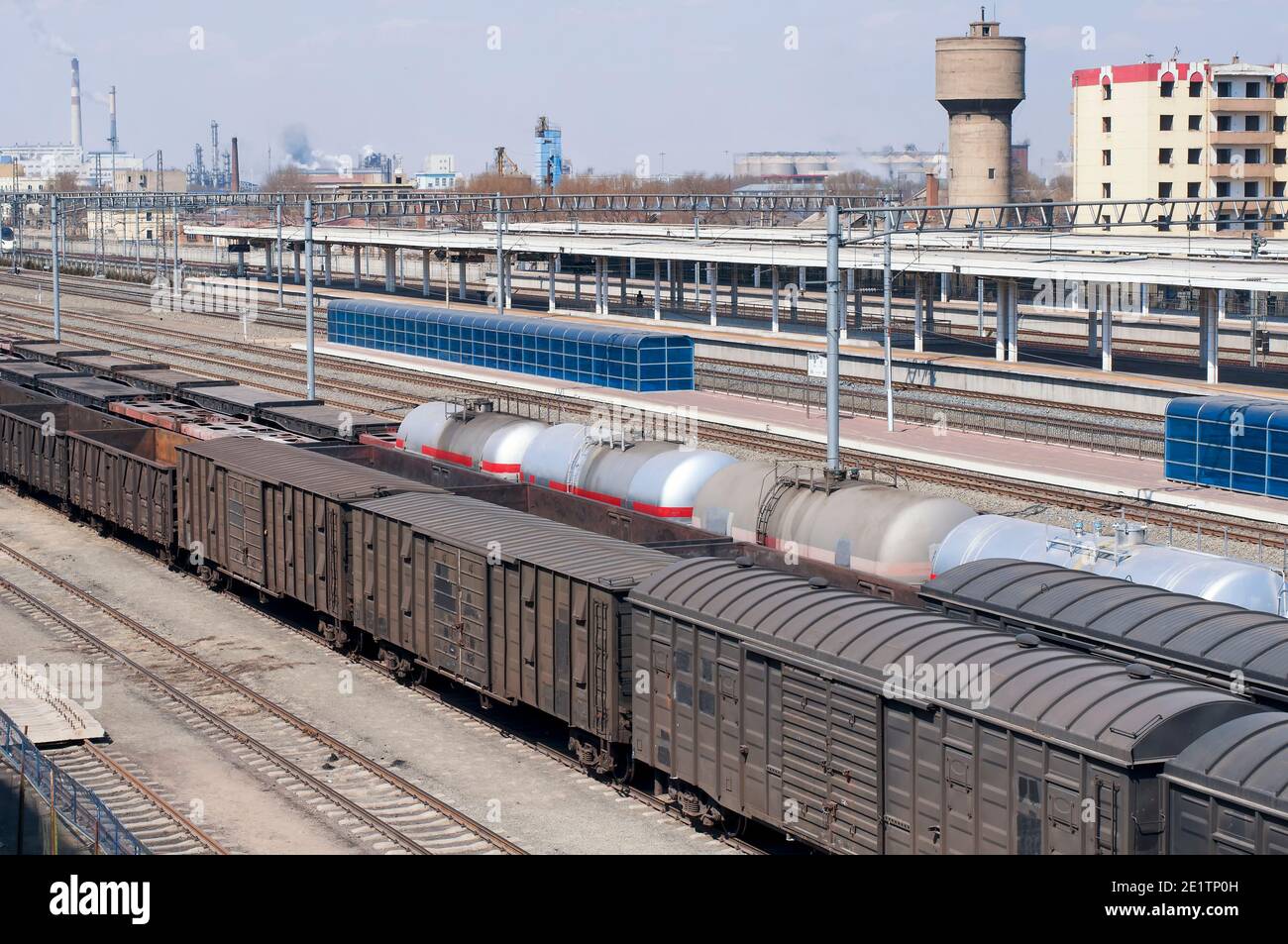 Tanker and box cars on a railroad in the city of zhaodong china on a ...