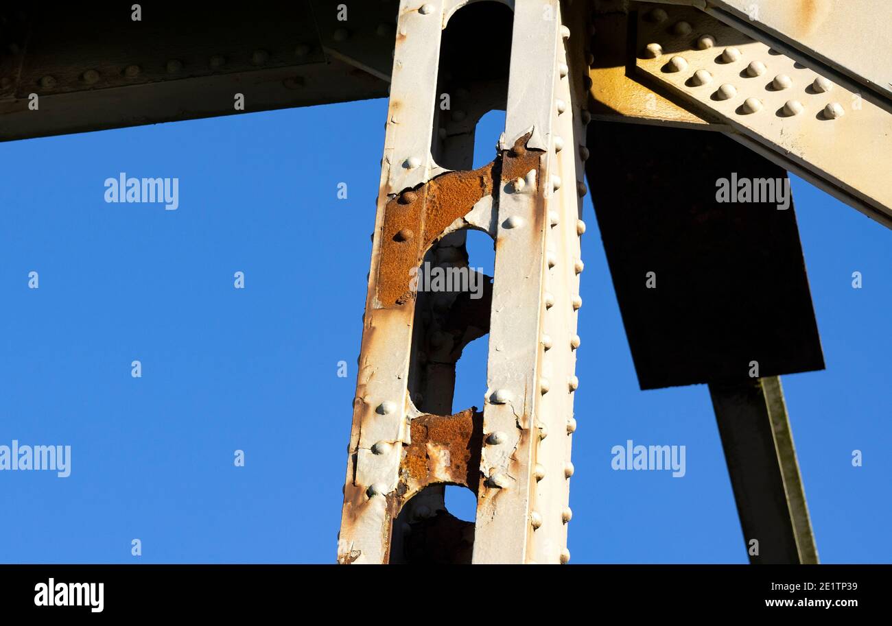 Rusty riveted metal girder bridge Stock Photo - Alamy