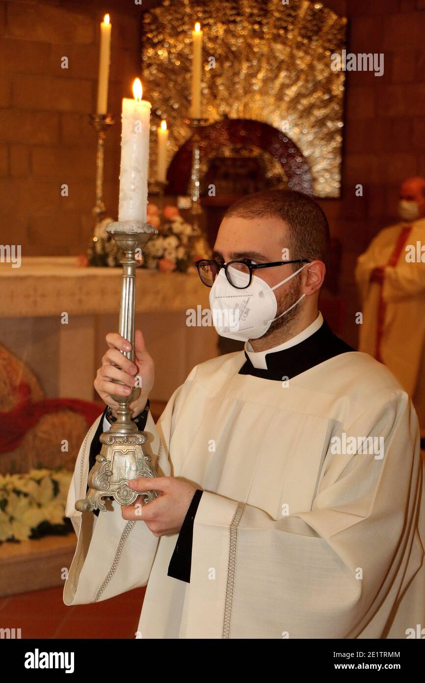 Priests wear surgical masks due to the Covid-19 pandemic during mass in ...