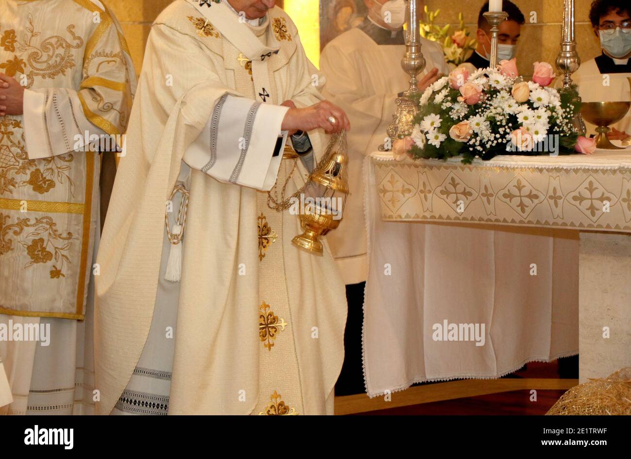 Priests wear surgical masks due to the Covid-19 pandemic during mass in ...