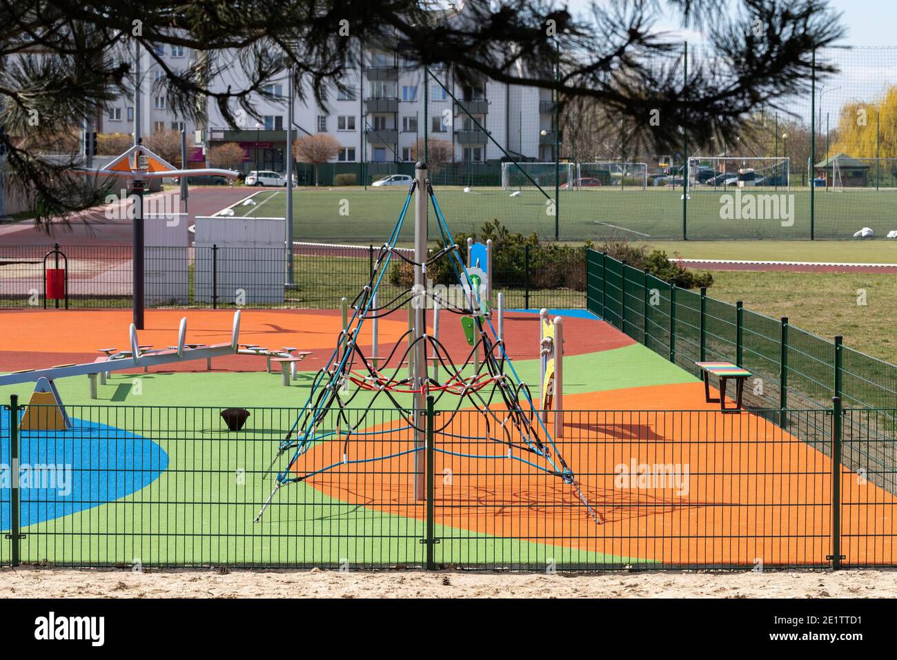 A separate and fenced play area for children with a safe, colorful ...