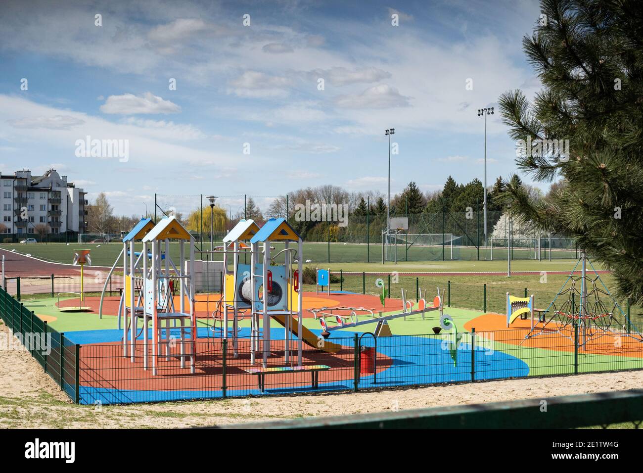 A separate and fenced play area for children with a safe, colorful ...
