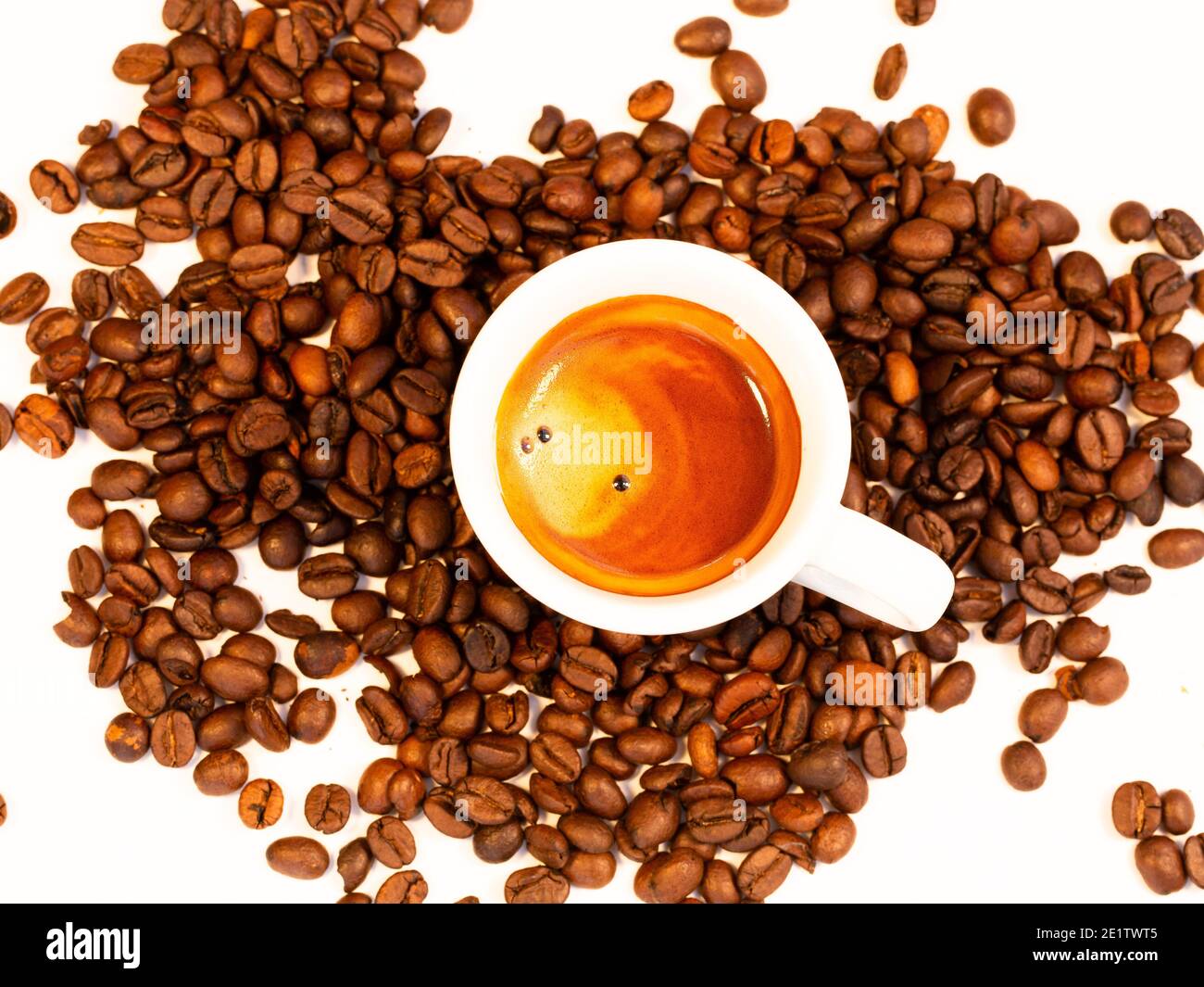 espresso on a bed of coffee.Roasted coffee beans background.Cup of ...