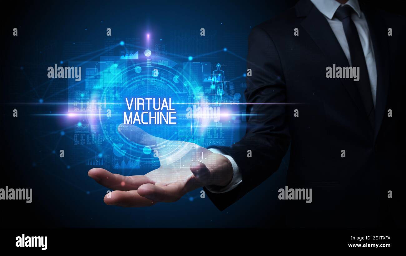 Man hand holding VIRTUAL MACHINE inscription, technology concept Stock ...