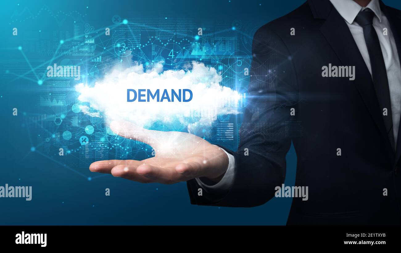 Hand of Businessman holding DEMAND inscription, successful business ...